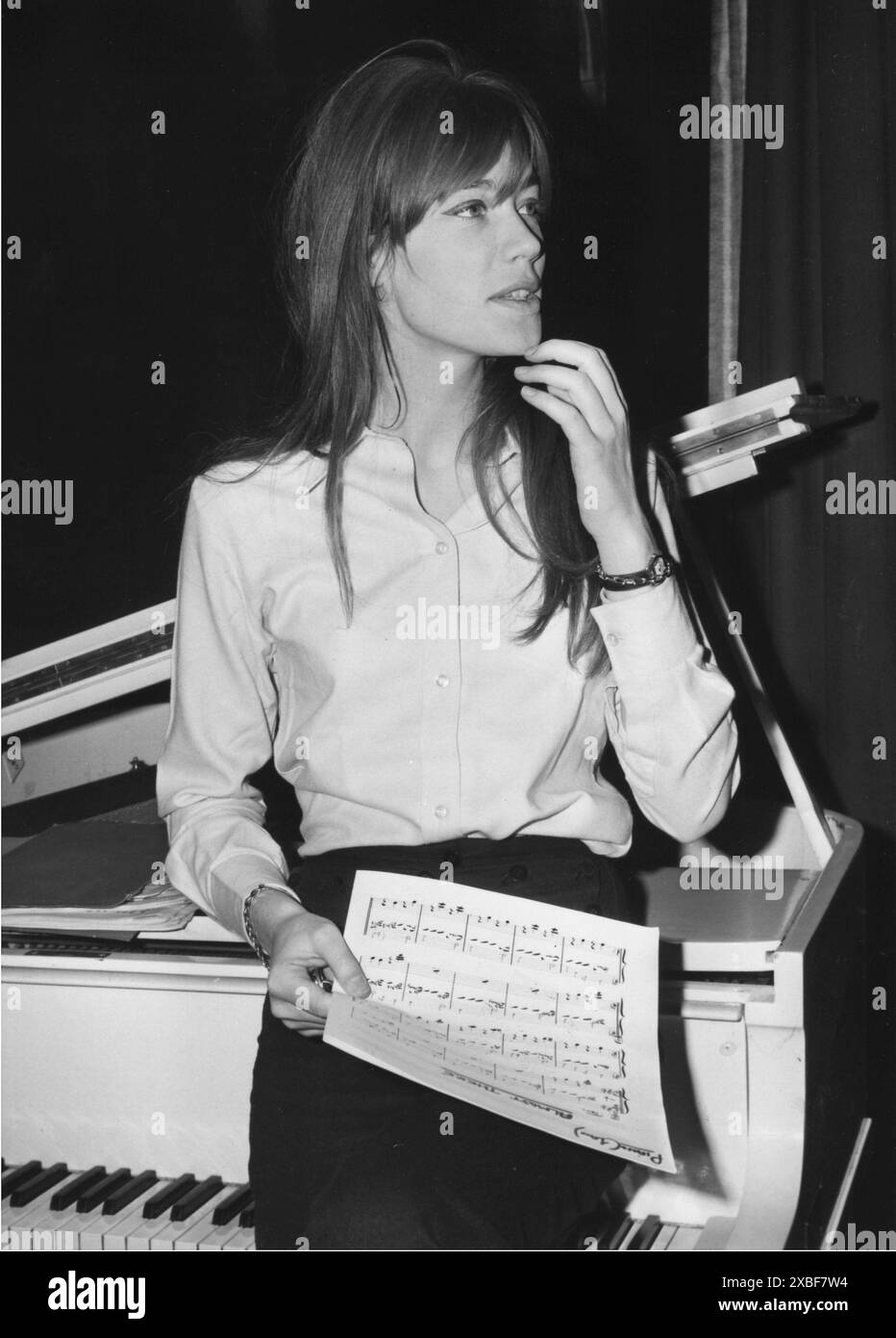 FILE - French singing star, Francoise Hardy, looks at a music score ...