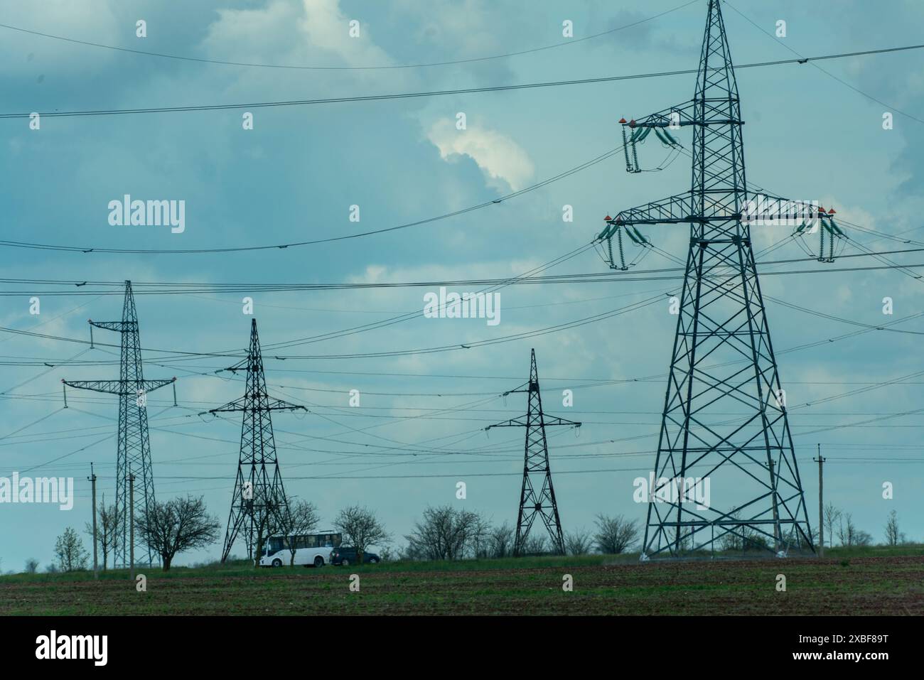 High voltage towers with sky background. Power line support with wires ...