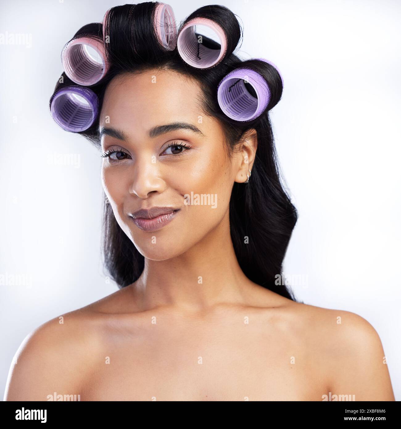 Beauty portrait, woman and rollers in hair for curly style with salon ...