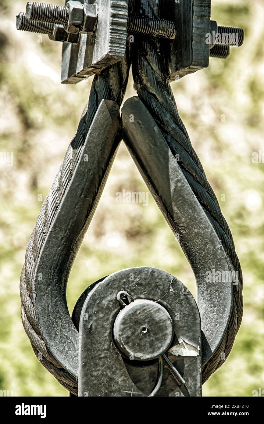 Shabby golden cable and rope fastening system with iron loop and hook ...