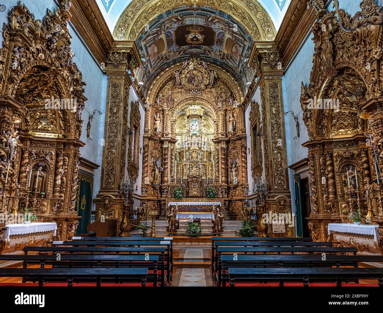 The intricate golden interior of the Carmelite church Igreja do Carmo ...