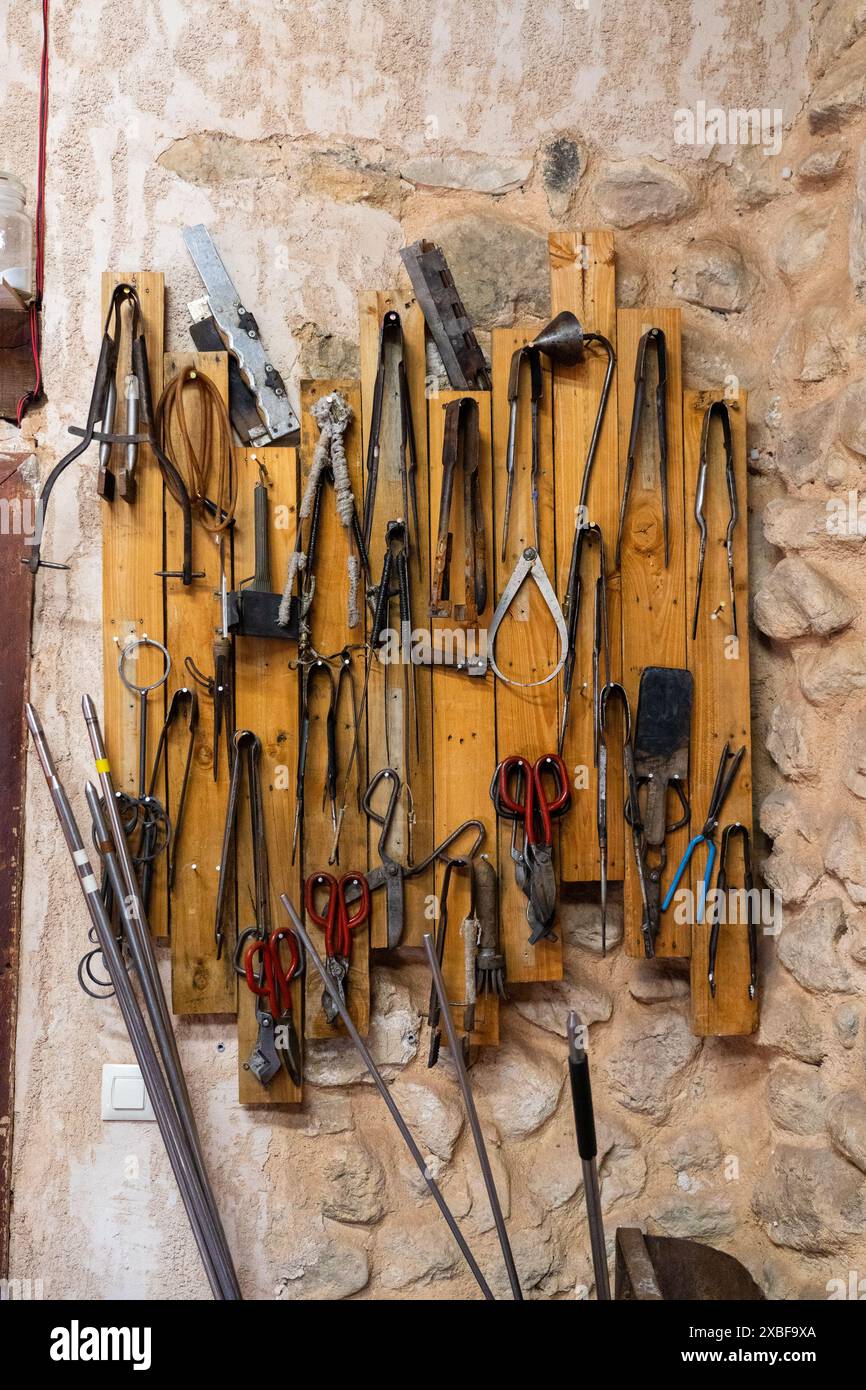 Glass blowing tools in a craft glass blowing workshop Stock Photo - Alamy