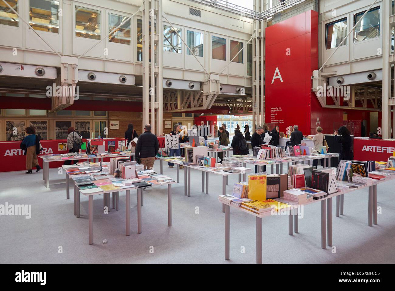 BOLOGNA, ITALY - FEBRUARY 2, 2024: Arte Fiera bookshop, people and art ...