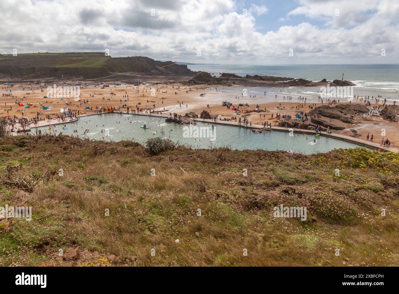 Low tide at Bude beach showing the tidal pool,which forms a safe ...