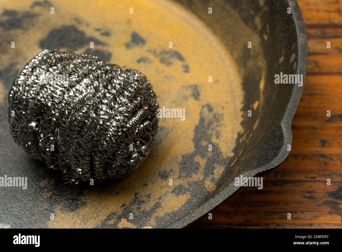Steel wool scrubbers or stainless steel scrubbers on top of rusty cast ...