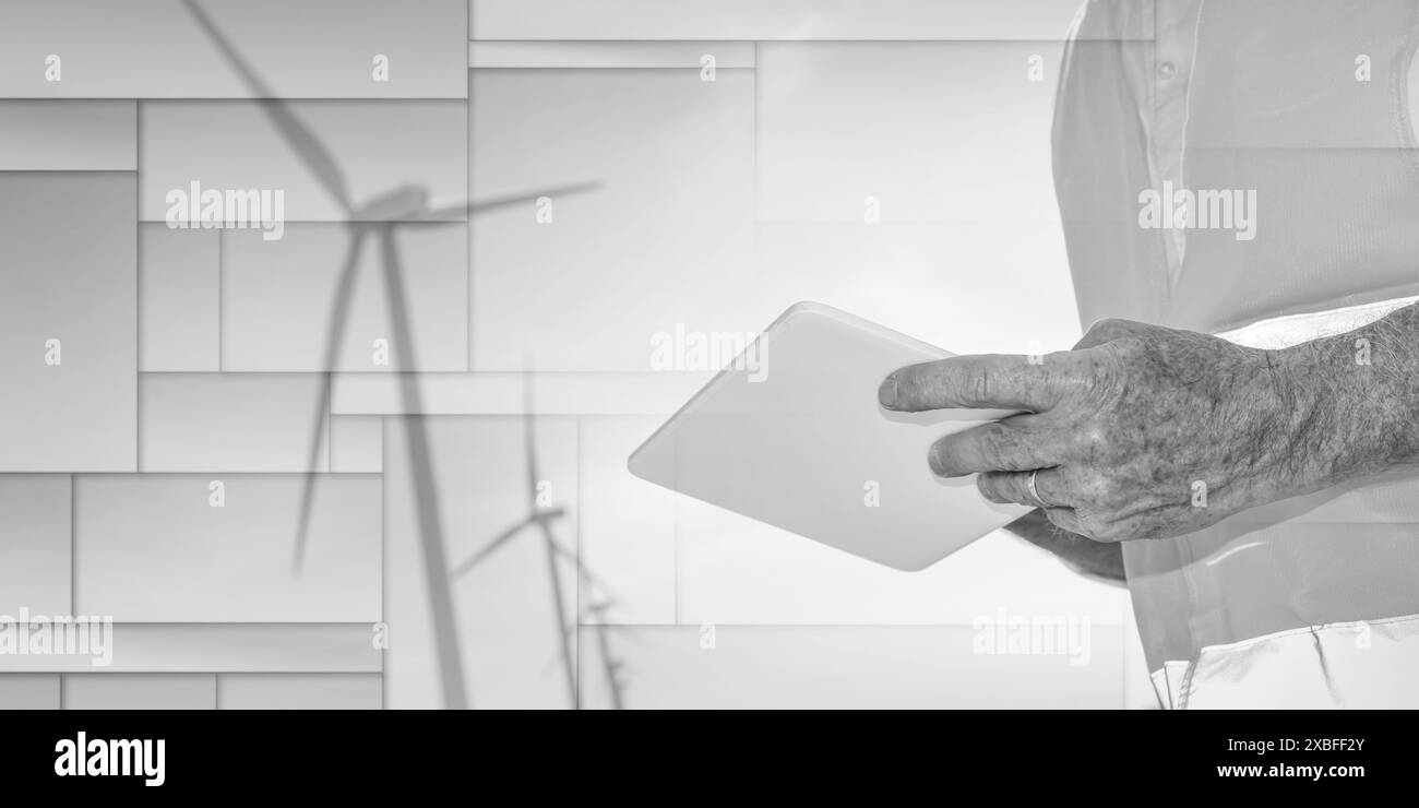 Electrical engineer using digital tablet for wind turbine inspection ...