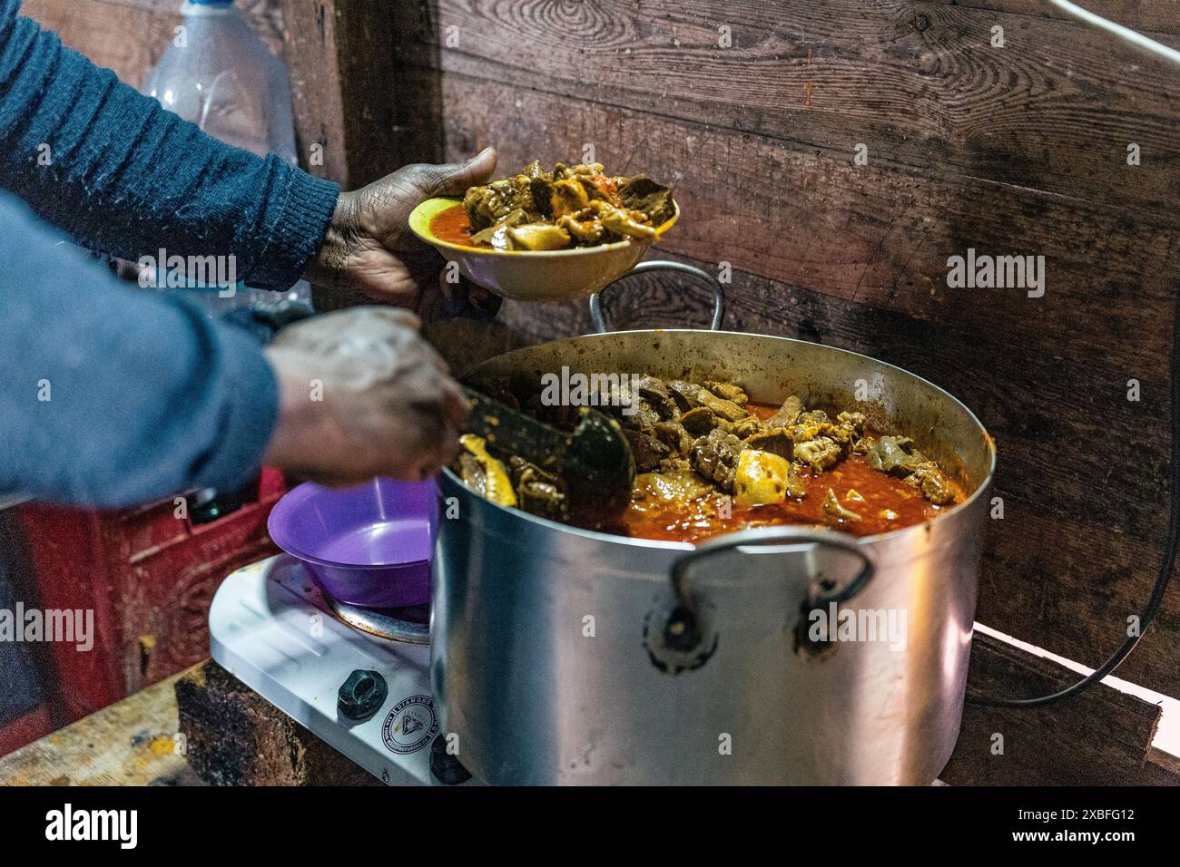 Women dishing up tripe Stock Photo - Alamy