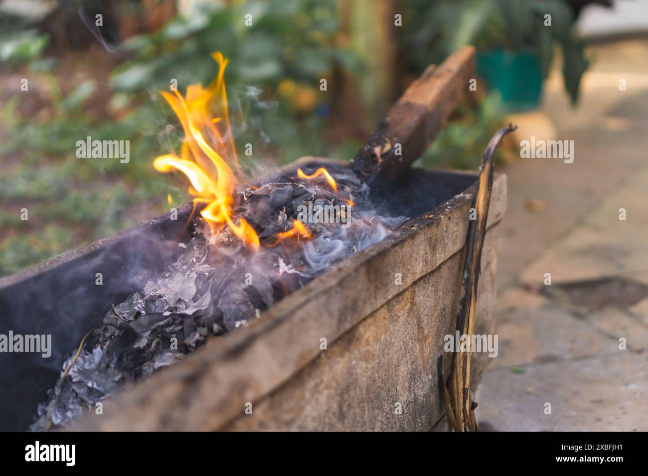 Burning piles of dry leaves in the backyard, the concept of air ...