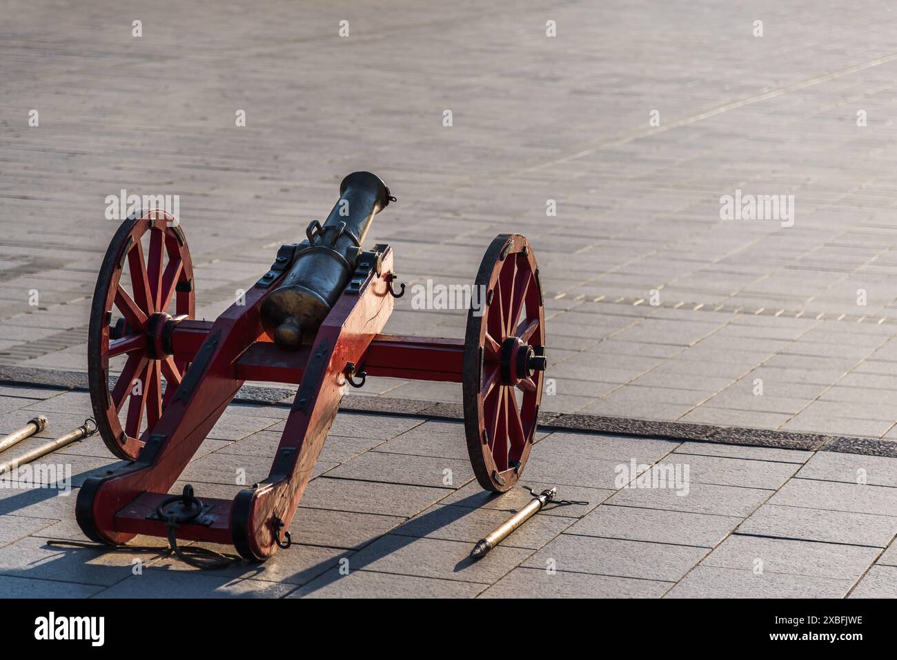 Old Antique Two Wheels Cannon Standing In A Town Square Stock Photo - Alamy