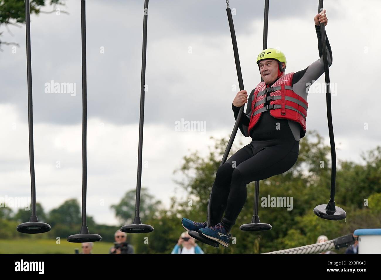 Liberal Democrats leader Sir Ed Davey attempts an Aqua Jungle floating ...