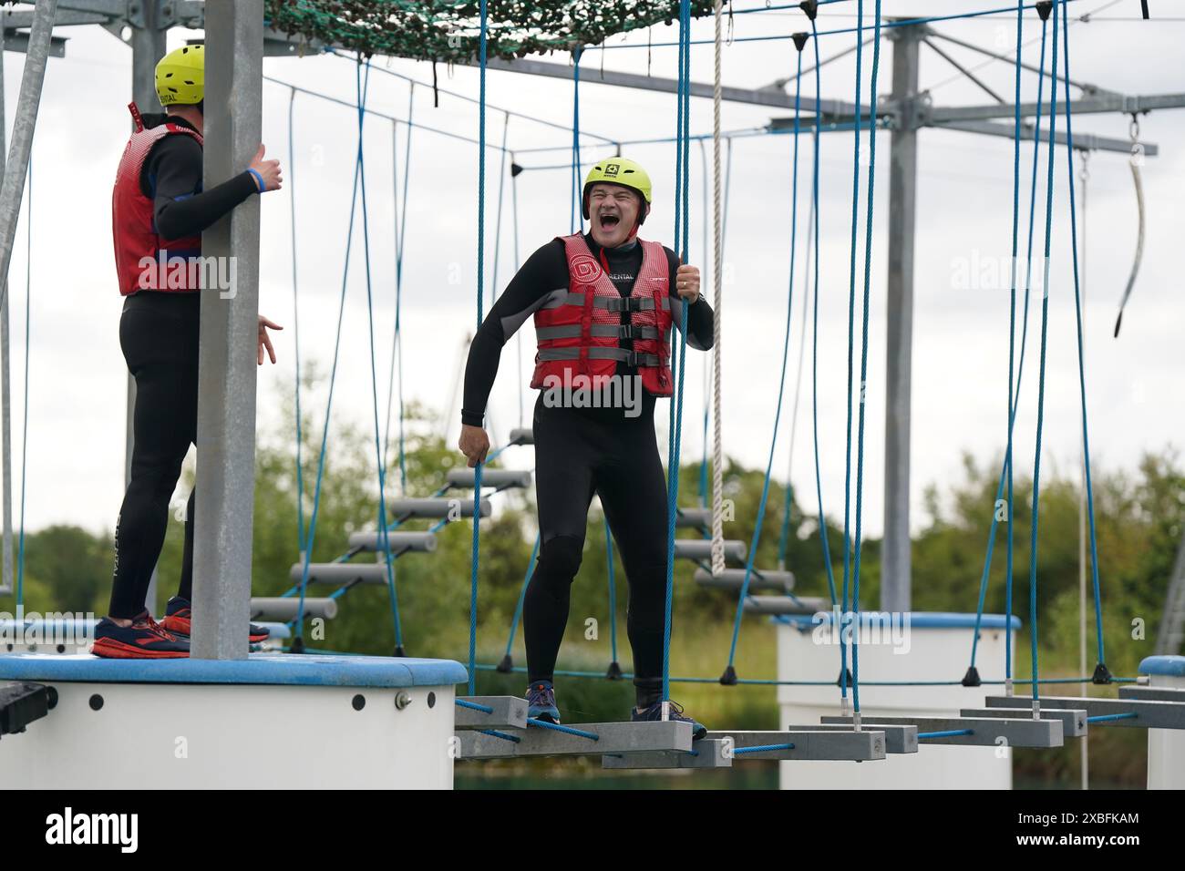 Liberal Democrats leader Sir Ed Davey attempts an Aqua Jungle floating ...