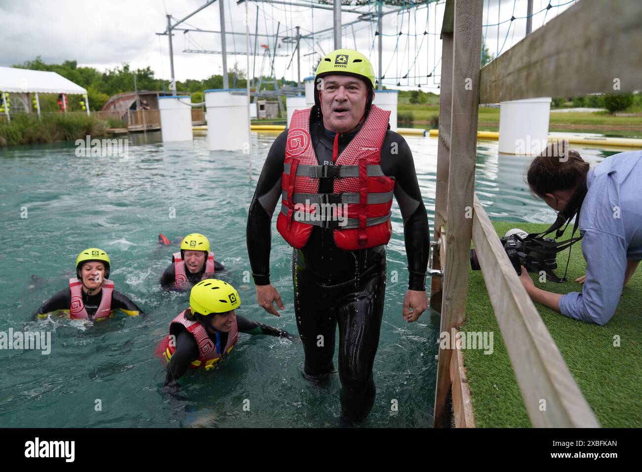 Liberal Democrats leader Sir Ed Davey attempts an Aqua Jungle floating ...