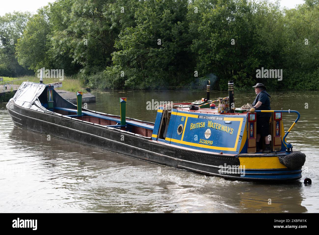 Heritage narrowboat "Scorpio" on the Grand Union Canal at Hatton Locks ...