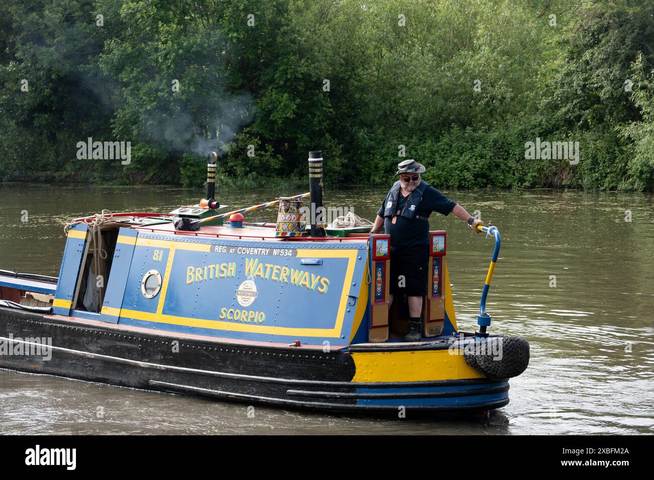 Heritage narrowboat "Scorpio" on the Grand Union Canal at Hatton Locks ...