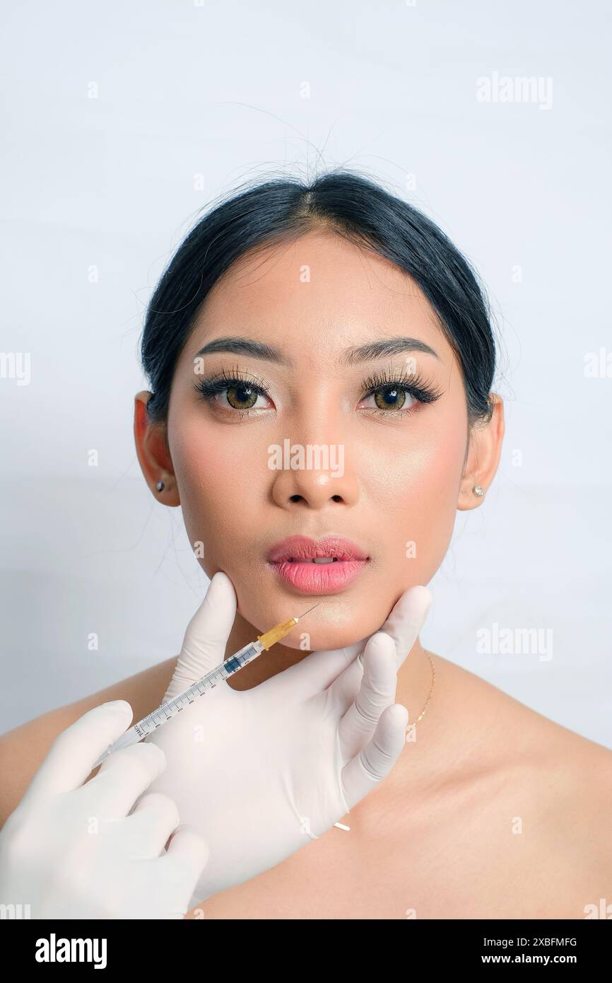 Beautiful female receiving rejuvenation patient hi-res stock photography and images - Alamy