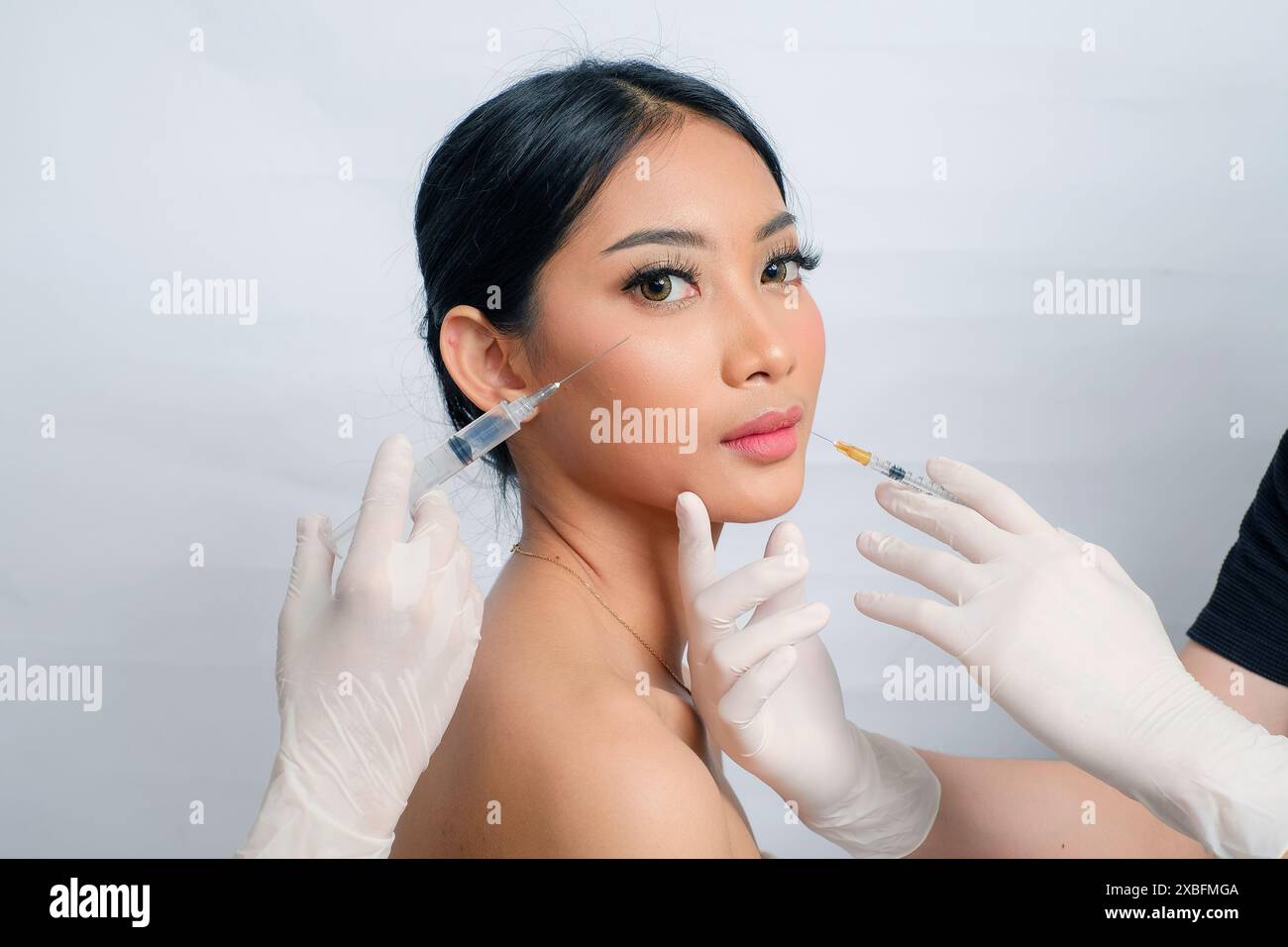 Beauty Asian Woman with Hair in a Bun Undergoing Fat Removal Injection ...