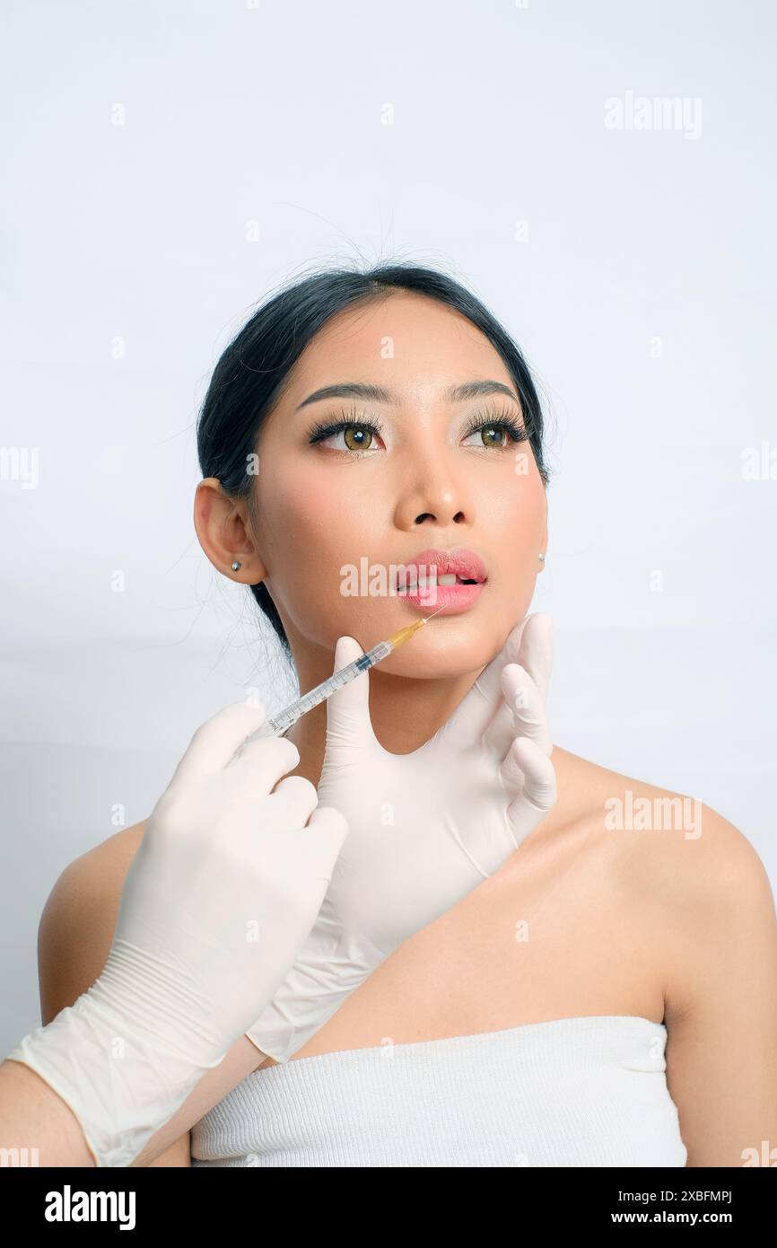 Sophisticated Asian Woman with Updo Getting Filler Injection Stock ...
