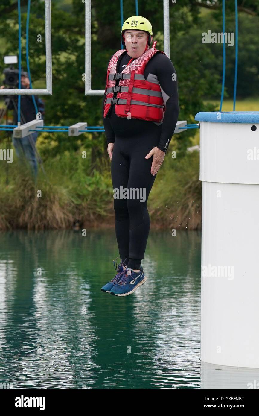 Liberal Democrats leader Sir Ed Davey jumps into the water as he ...