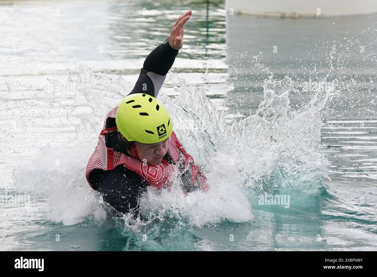 Liberal Democrats leader Sir Ed Davey jumps into the water as he ...