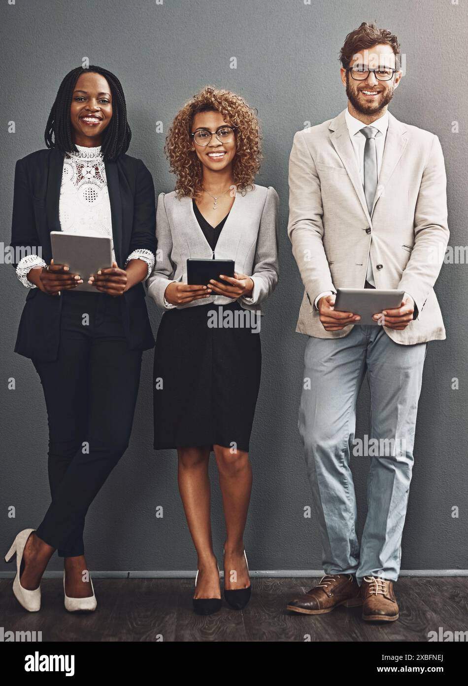Tablet, portrait and business people by office wall with line, smile ...