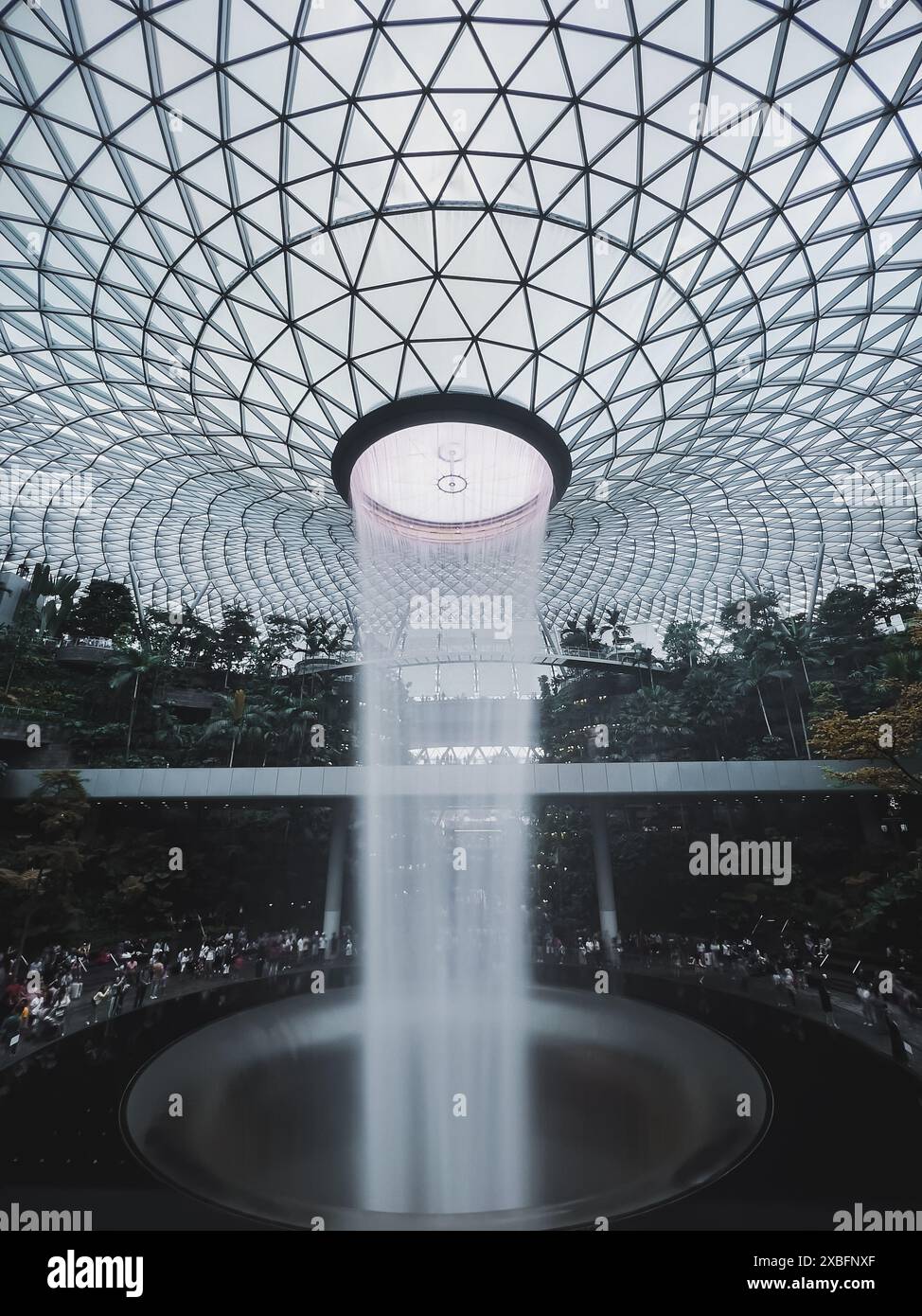 The Rain Vortex waterfall at Jewel Changi Airport in Singapore with a ...