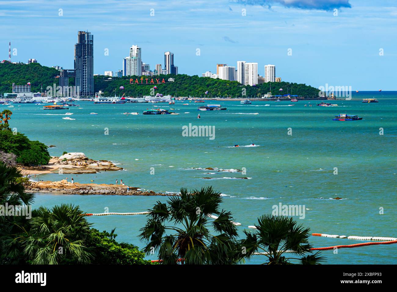View of Pattaya Bay in the morning with parasailing and other many ...