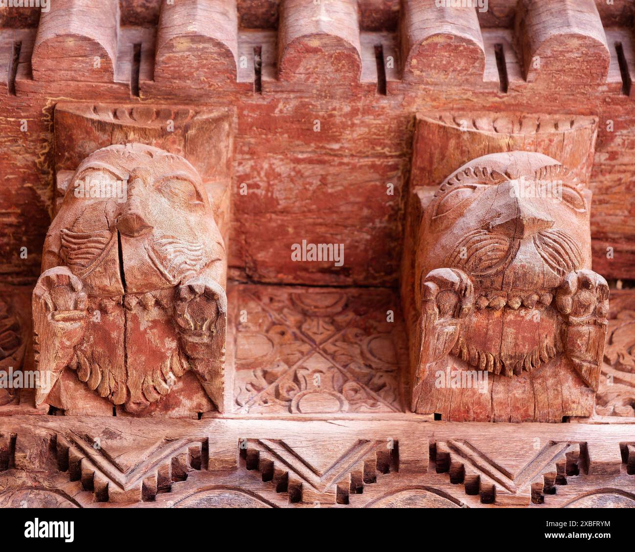 A Close-up of intricate wooden carvings depicting mythical creatures on ...