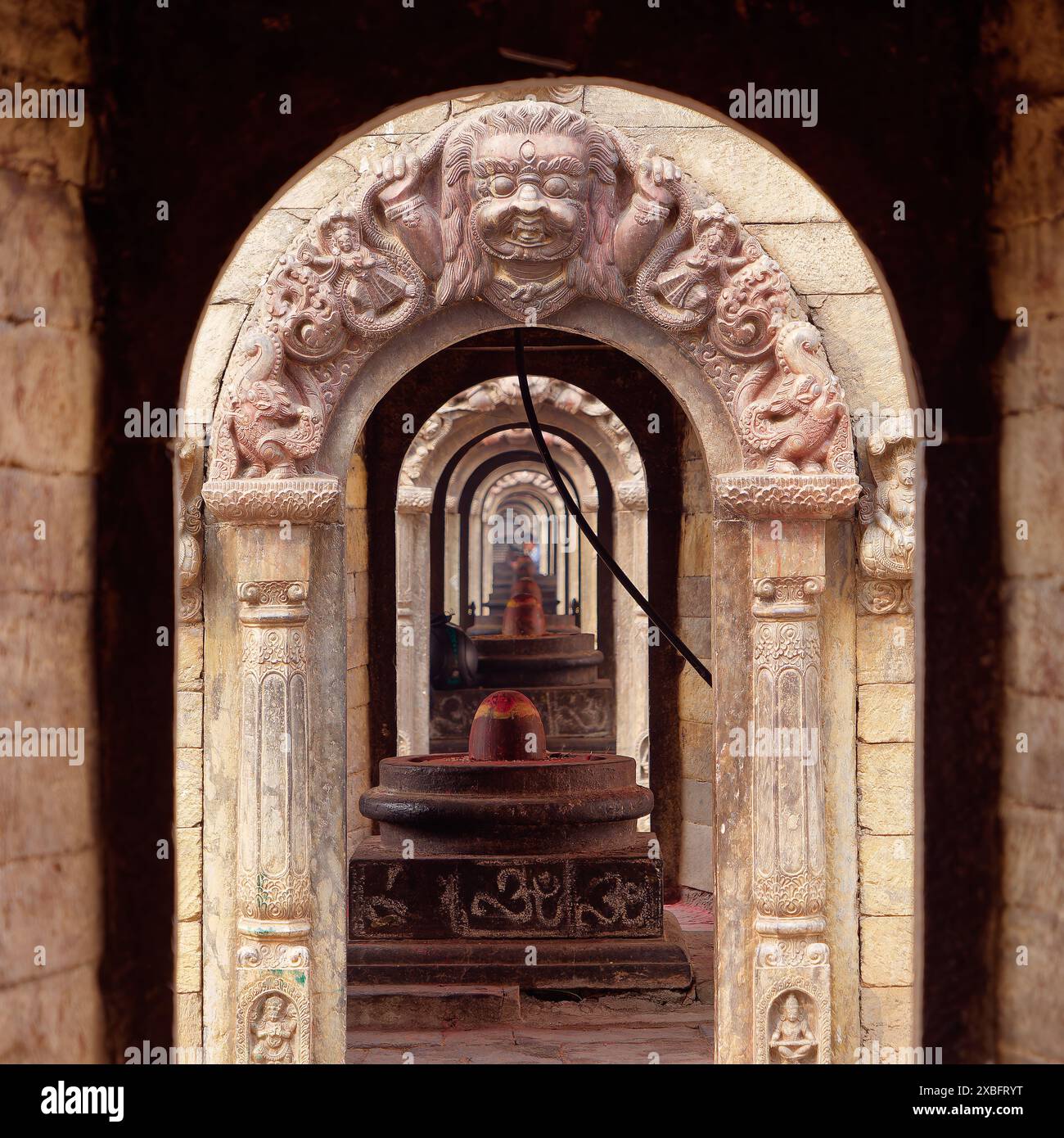 A series of intricately carved stone arches with religious symbols in a ...