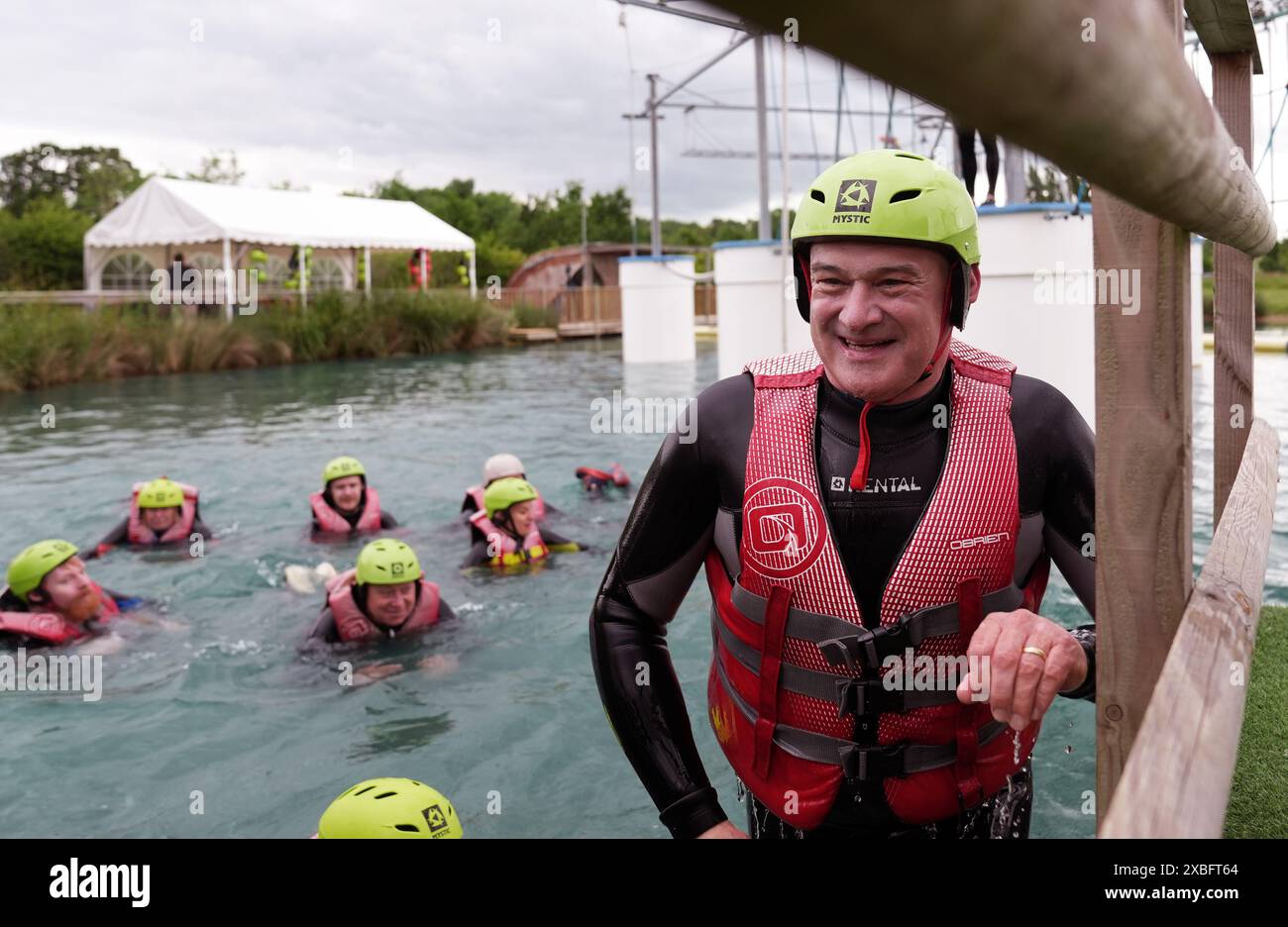 Liberal Democrats leader Sir Ed Davey attempts an Aqua Jungle floating ...