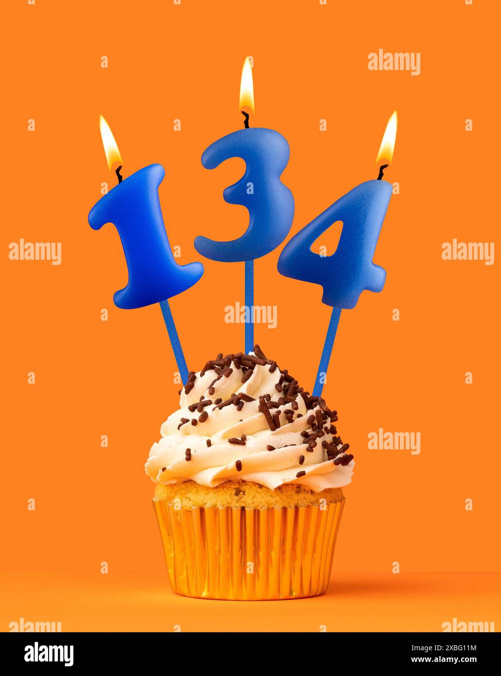 Blue birthday candle and cupcake - Number 134 Stock Photo - Alamy