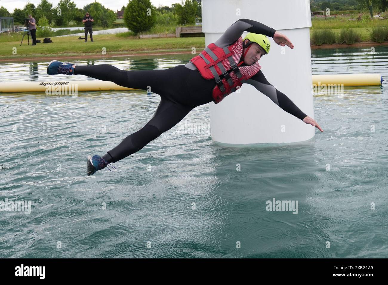 Liberal Democrats leader Sir Ed Davey jumps into the water as he ...