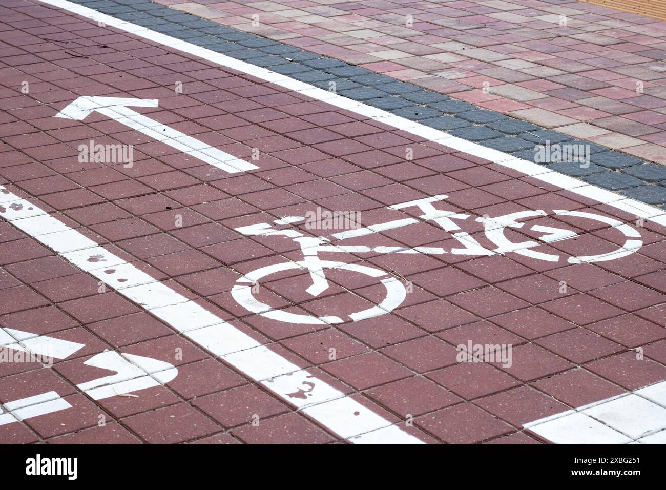 A bicycle lane marked with an arrow indicating the right direction ...