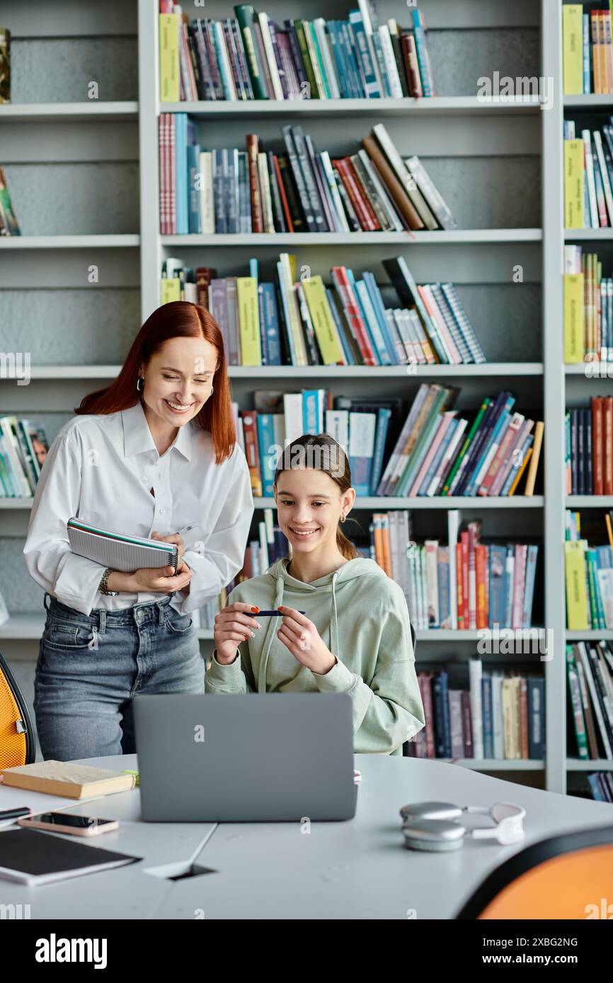 A redhead tutor teaches a teenage girl in a library, both engrossed ...