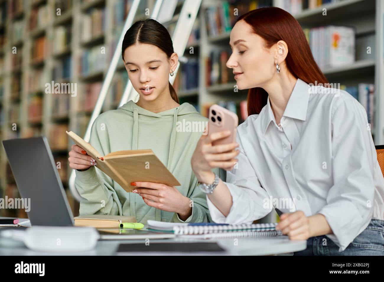 one redheaded tutor and a teenage girl, engrossed in a book at a ...