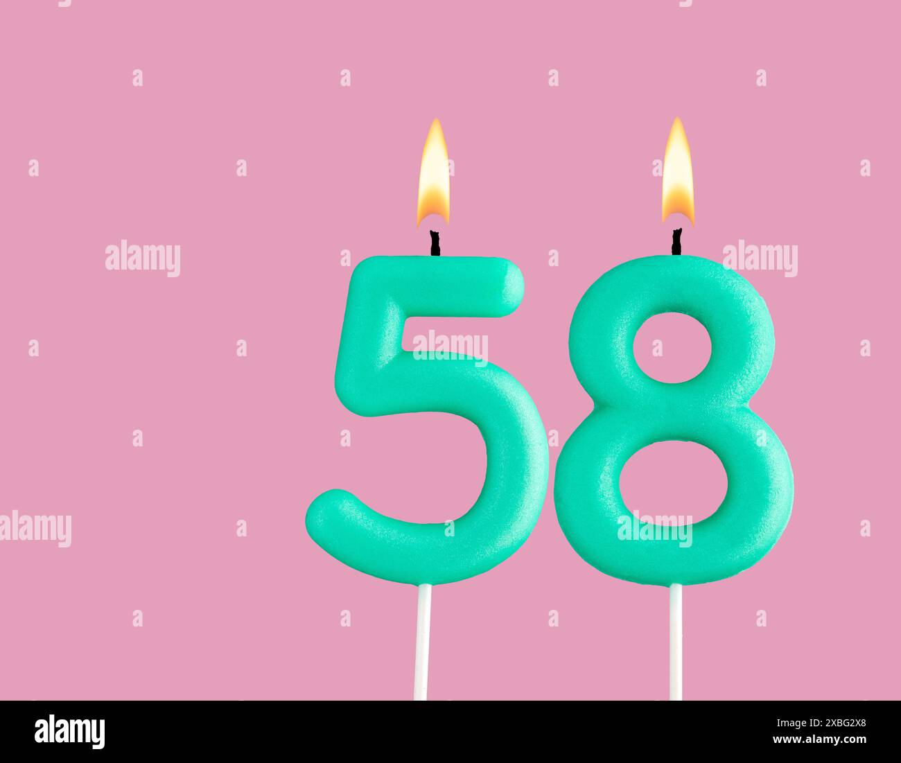 Green candle number 58 - Birthday card on pastel pink background Stock ...