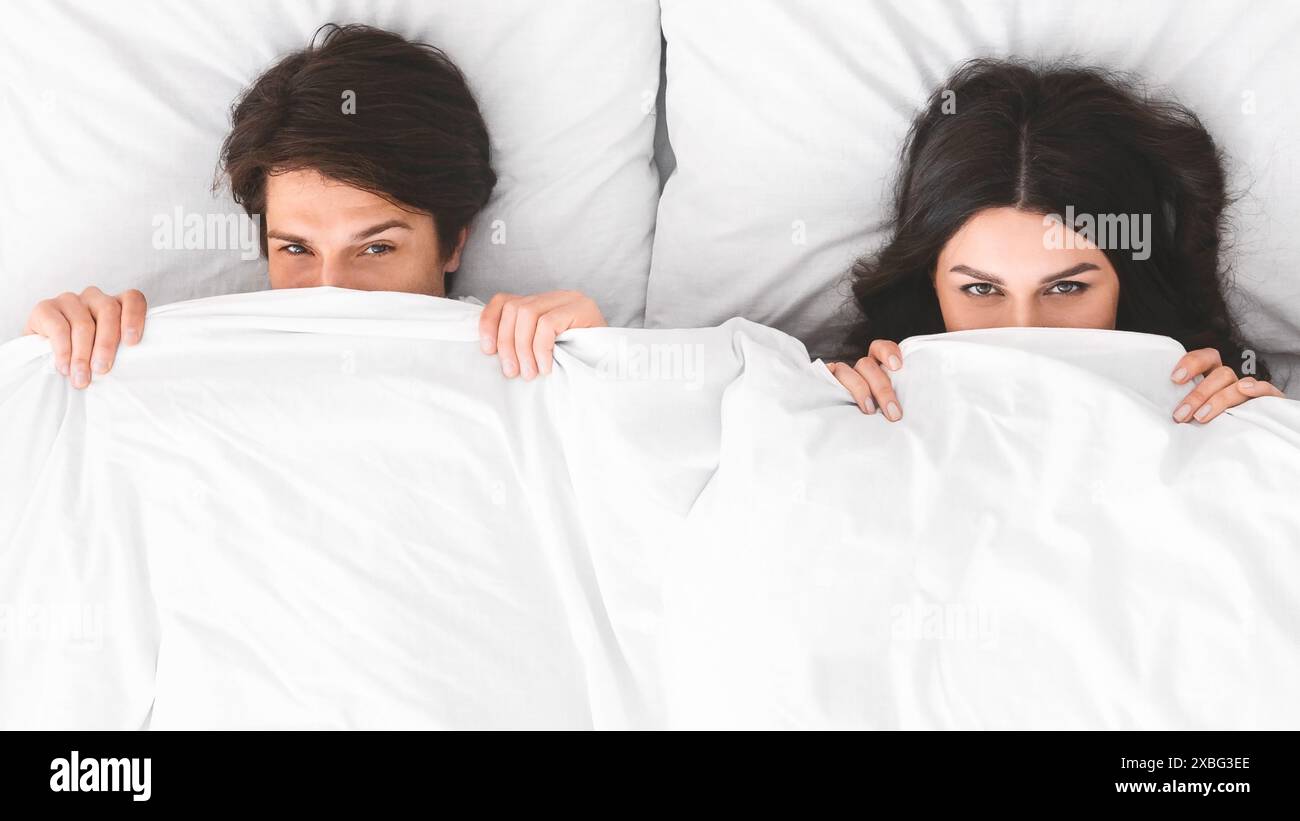 Happy family hiding under blanket hi-res stock photography and images ...