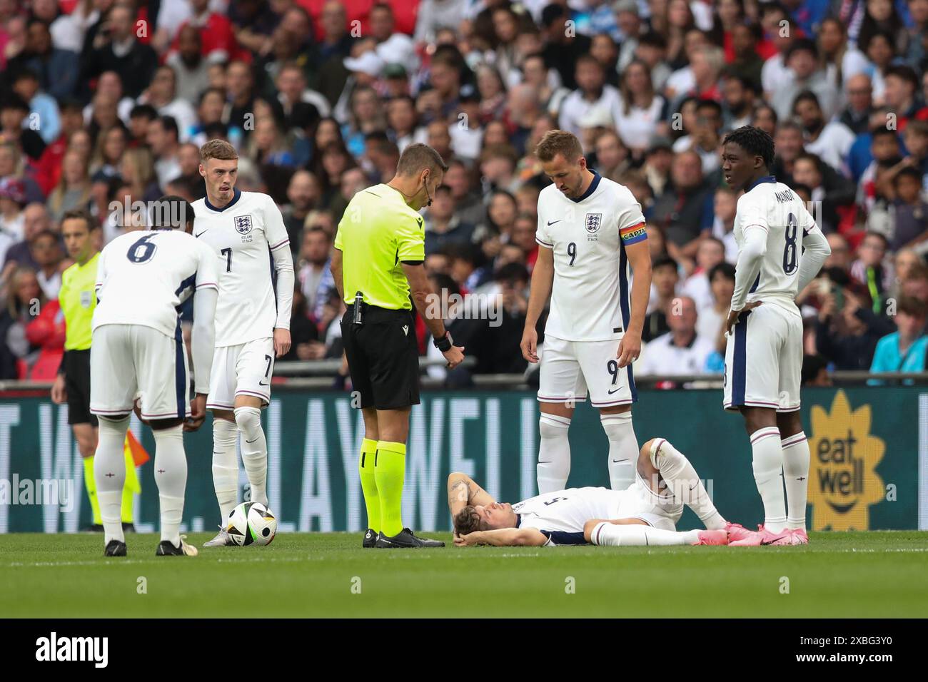 John Stones of England surrounded by England players after Ankle injury ...