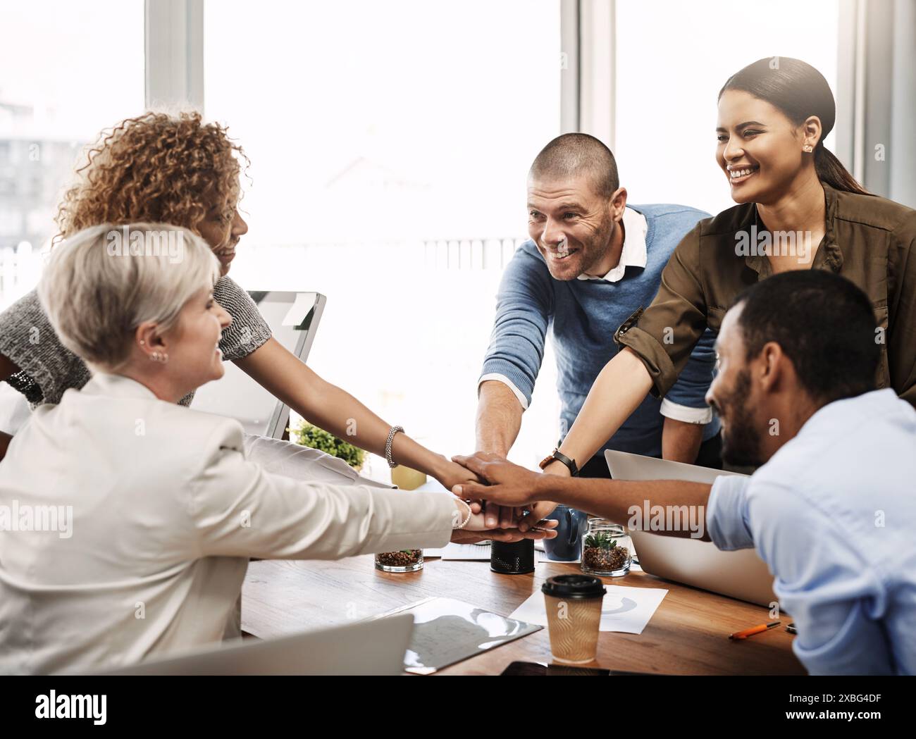 Teamwork, celebration and pile of hands with office, business people and partnership for support ...