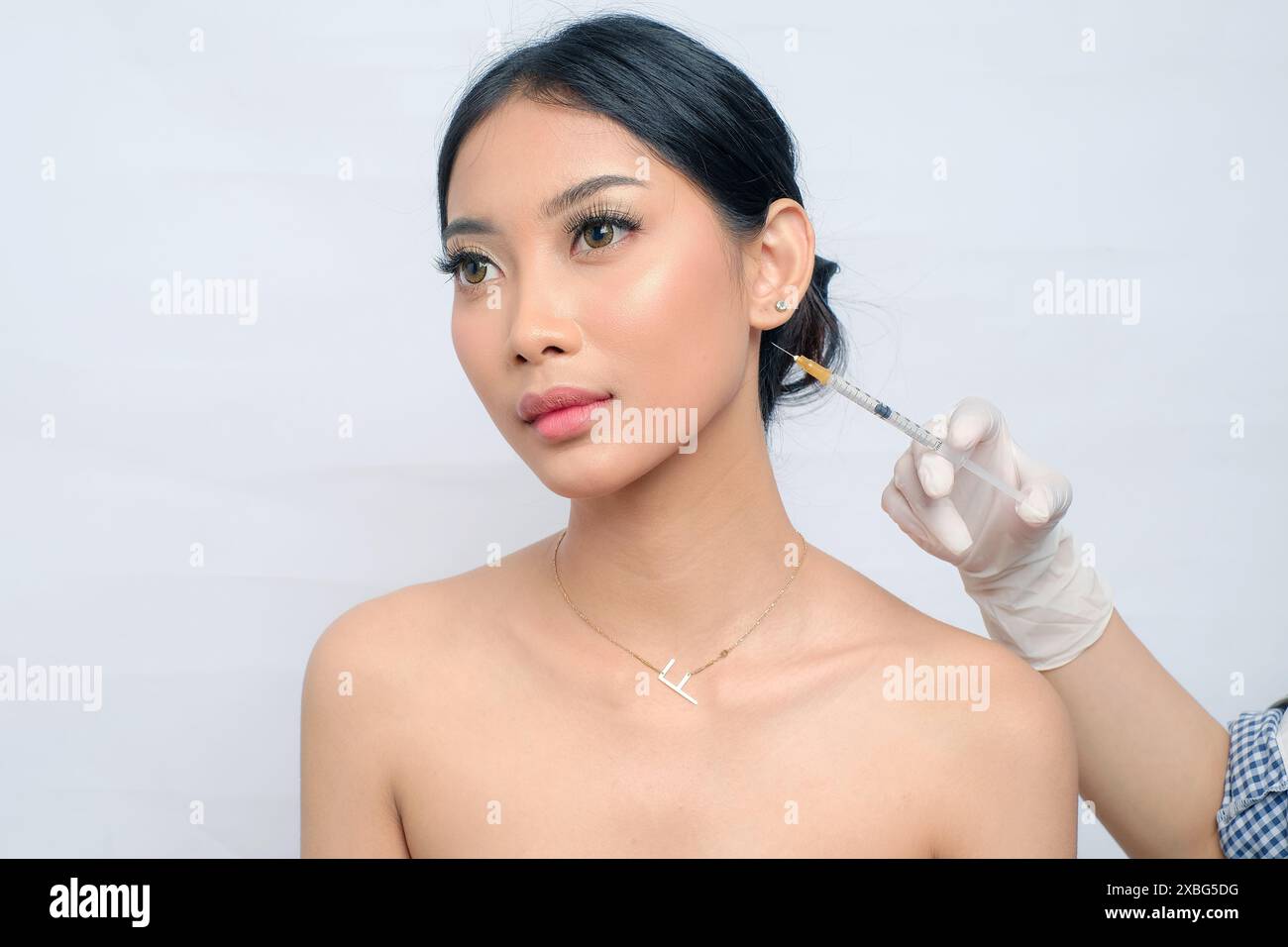 Beautiful Asian Woman with Updo Getting Botox for Younger-Looking Skin Stock Photo - Alamy