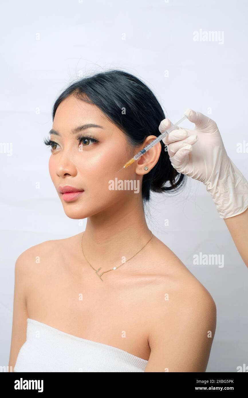Botox Injection Treatment for Wrinkle-Free Skin on Asian Woman with ...
