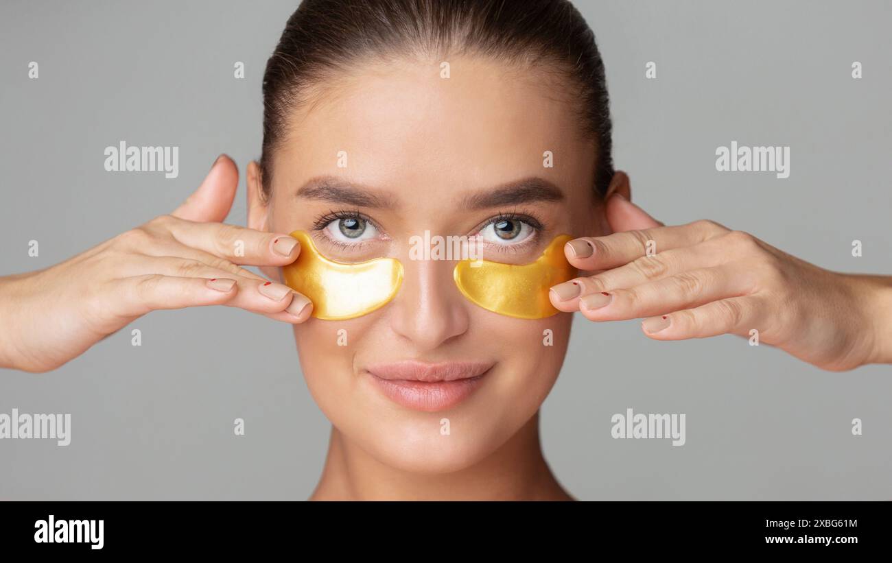 Woman Wearing Gold Eye Patches, Closeup Shot Stock Photo - Alamy