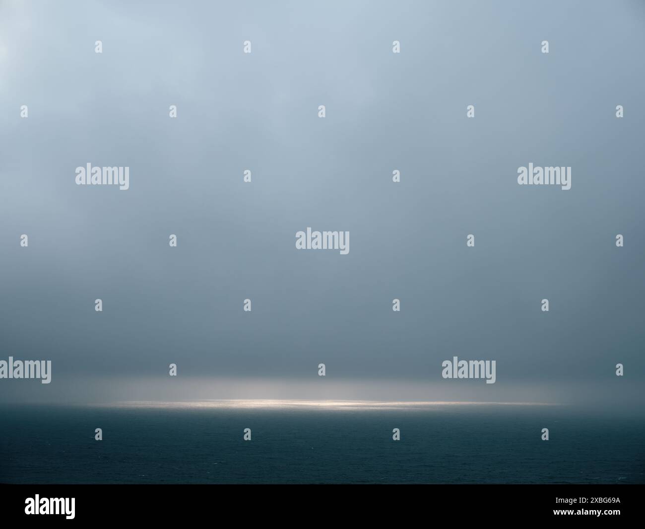 Empty seascape with light pooling on horizon line Stock Photo - Alamy