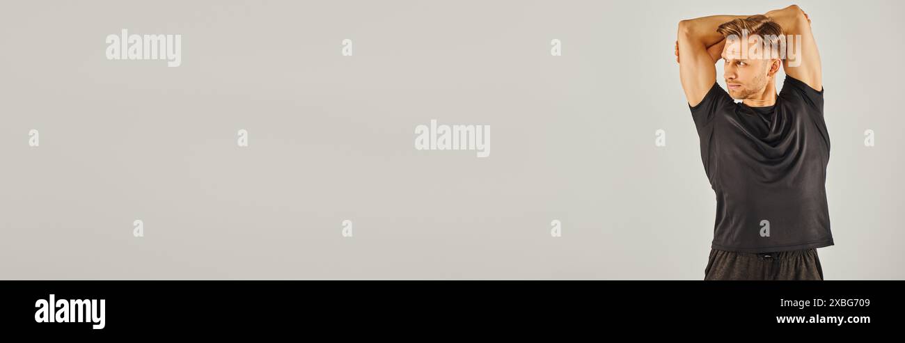 A young athletic man in active wear performing yoga poses with grace ...