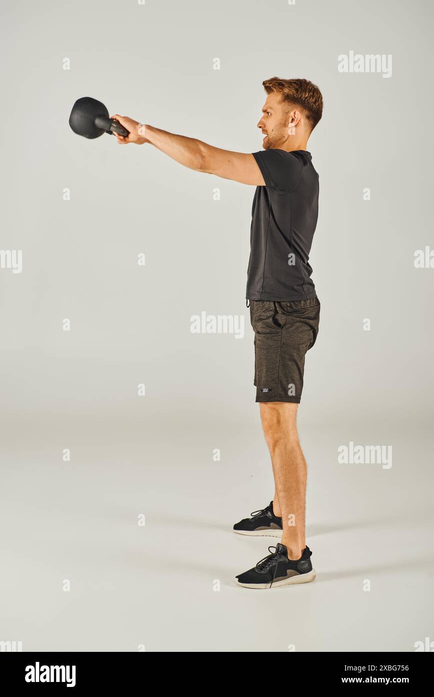 Young sportsman in active wear showcasing strength and determination ...