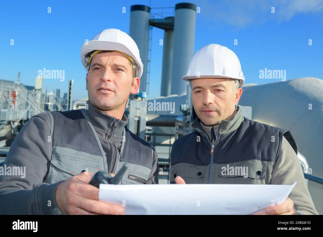 industrial engineers studying a plan Stock Photo - Alamy