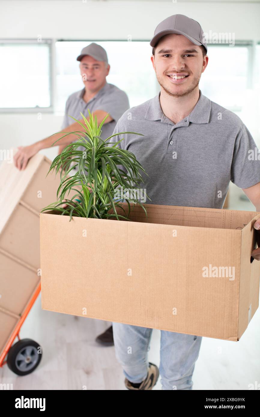 Warehouse employees carrying boxes hi-res stock photography and images ...
