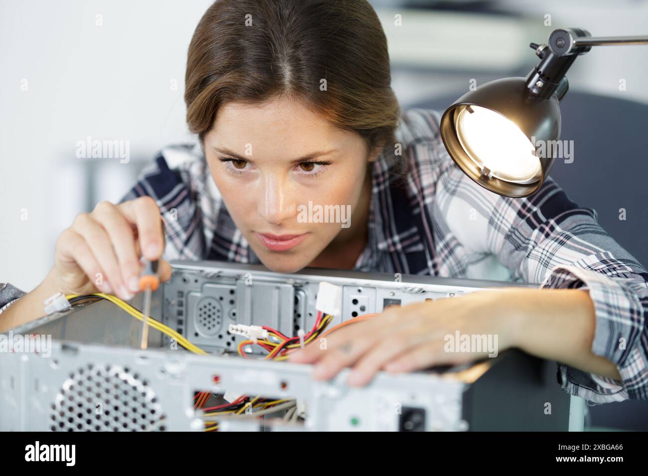 Female technician checking circuit board hi-res stock photography and ...