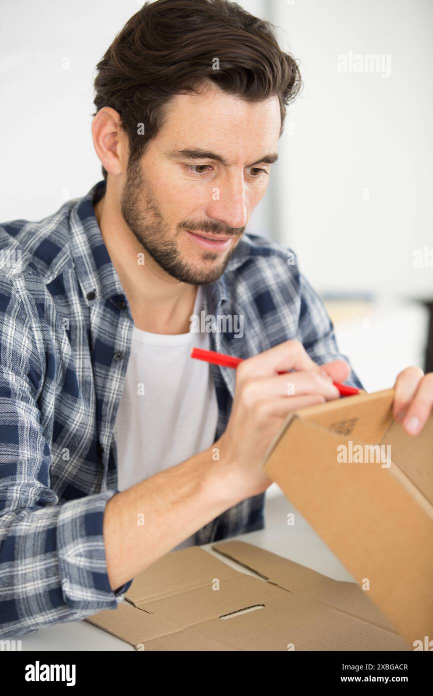 man drawing card board boxes Stock Photo - Alamy