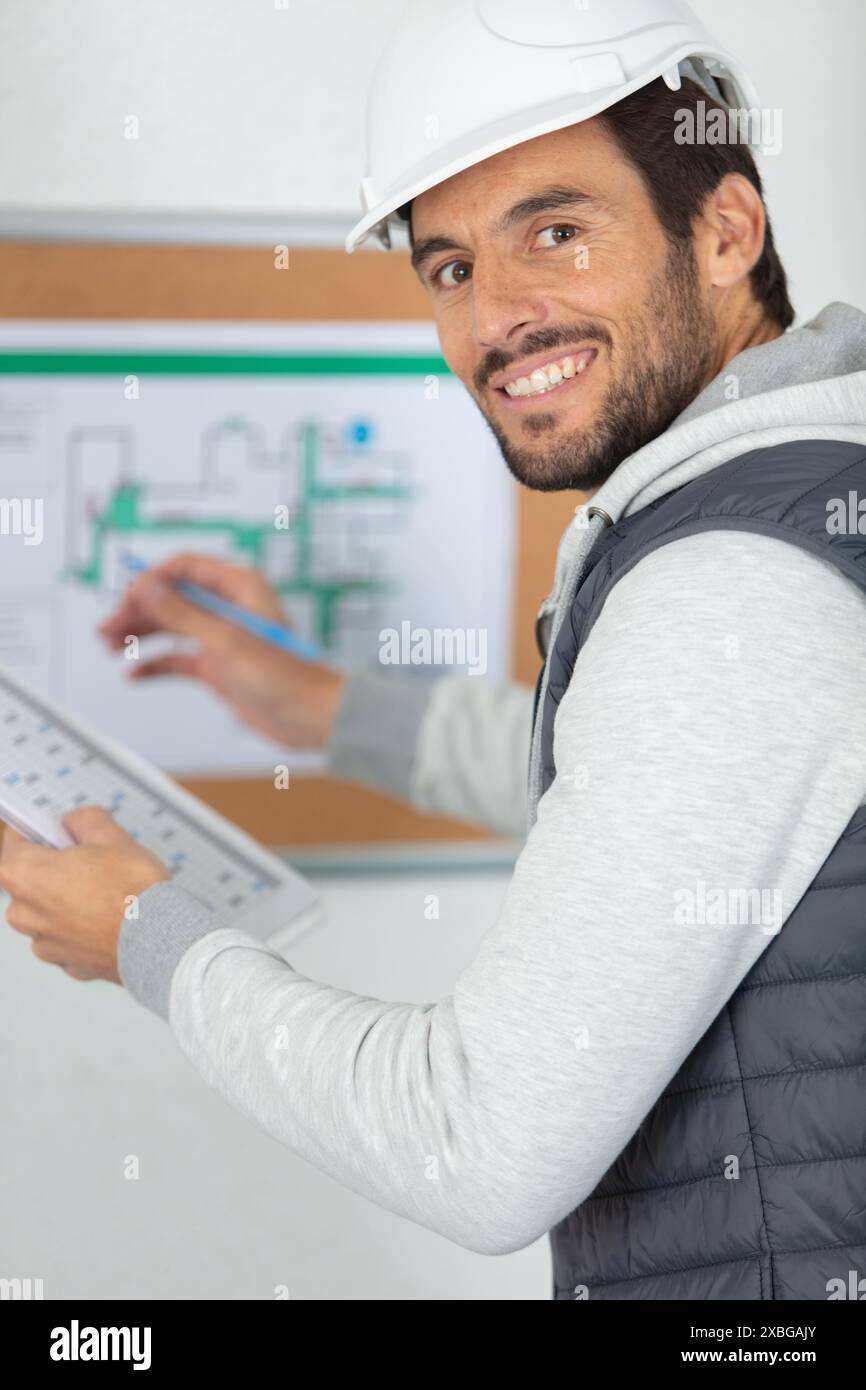 engineer is checking and inspecting the building Stock Photo - Alamy