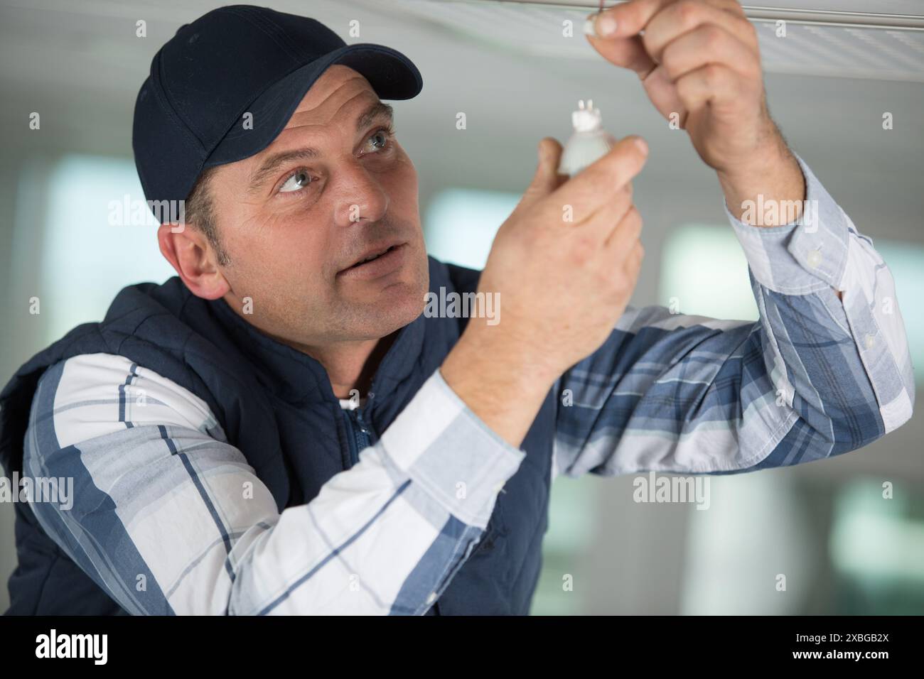 Hands electrician installing light hi-res stock photography and images ...